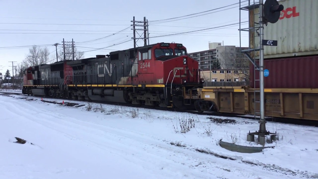 CN 5700 Leading a Intermodal Past St. James Junction West Departing ...