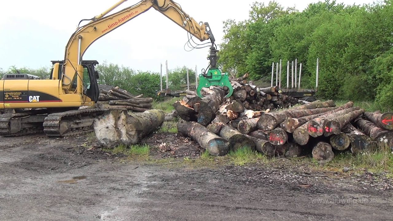 Wood Splitting with Excavator - Holz Spalten mit dem Bagger - YouTube