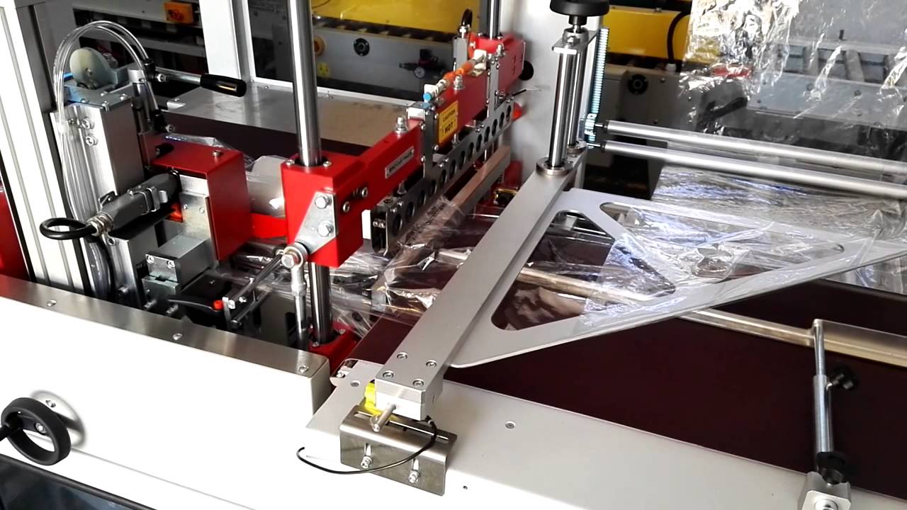 Filter side sealing shrink wrapping machine - YouTube