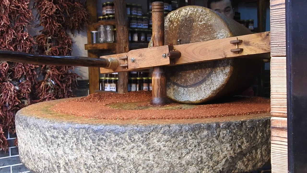 Stone-grinding of nuts - YouTube
