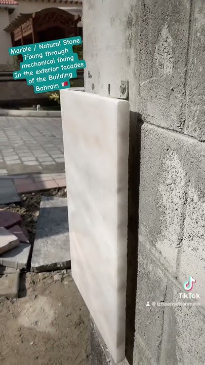 Marble stone mechanical fixing in the exterior facade of the building ...