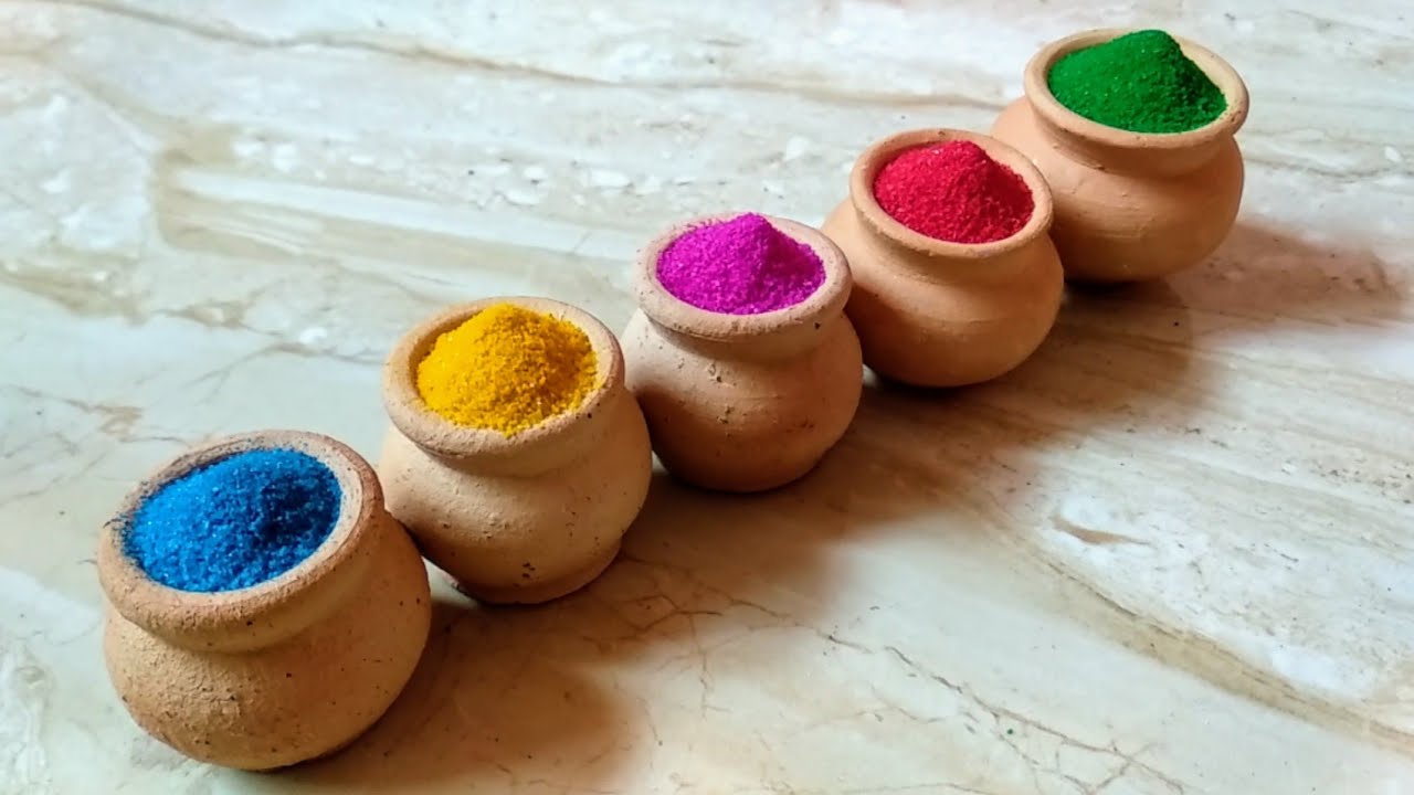 Holi special multicolored rangoli design by using small pots - YouTube