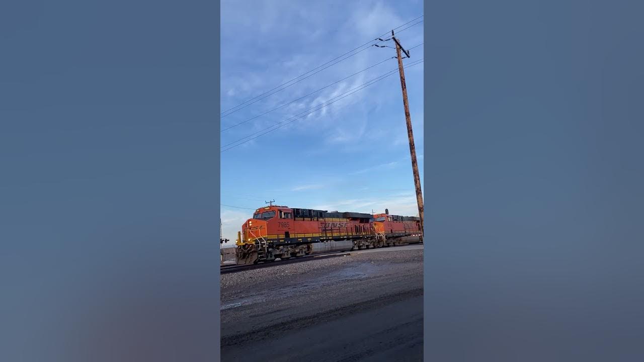 2 BNSF Gevos lead westbound autorack after being tied down - YouTube