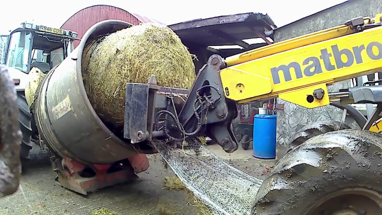 Matbro and bale shredder feeding the milk cows - YouTube