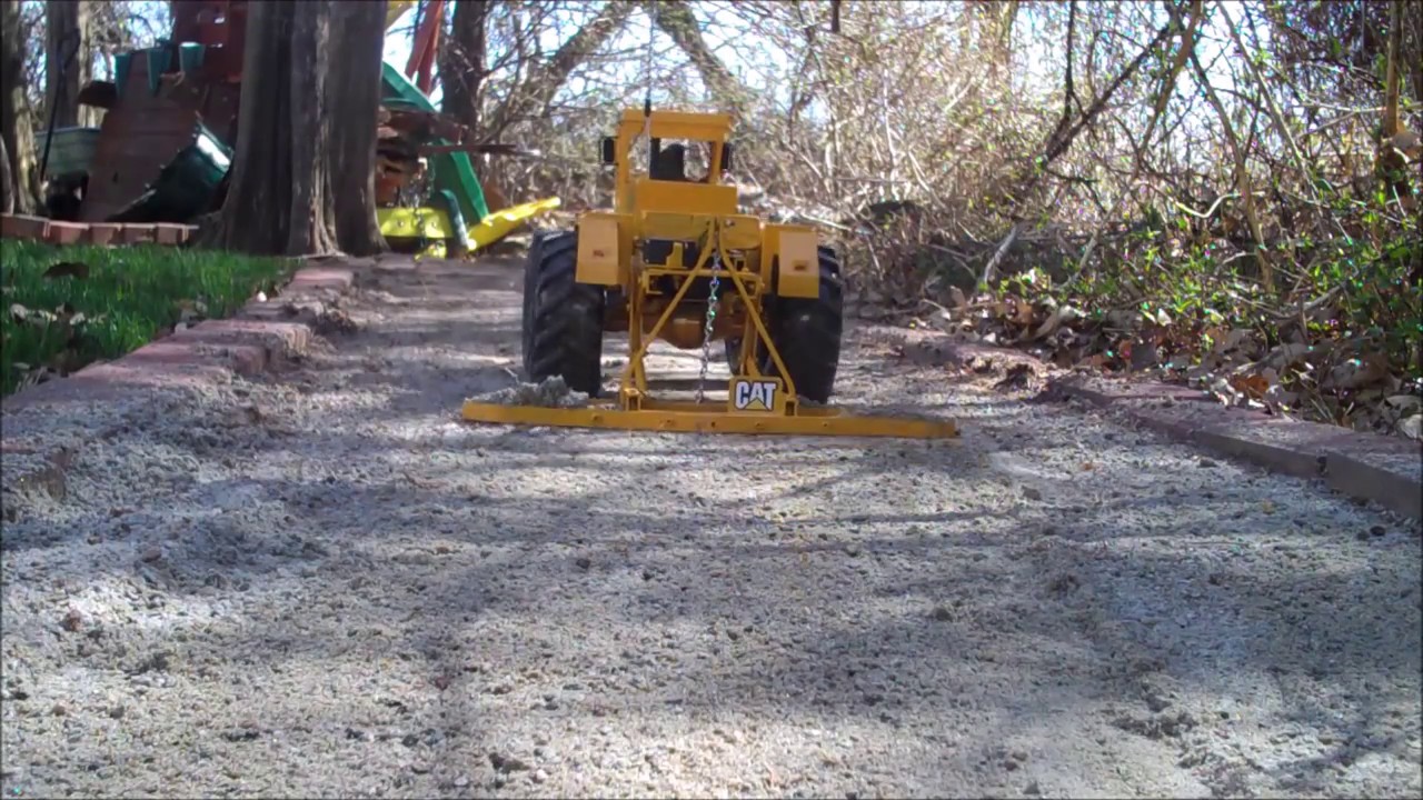 R/C CAT Tractor and Land Plane Leveler (Test 1) - YouTube