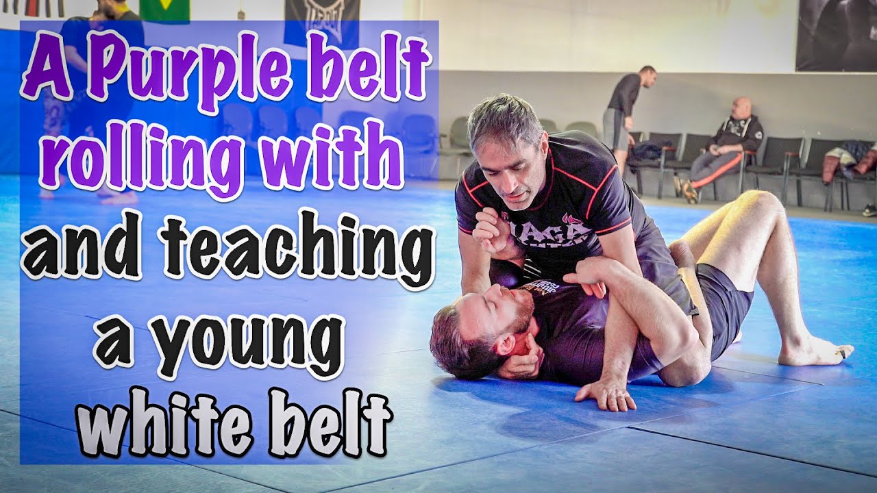 A purple belt rolling lesson with a white belt - YouTube