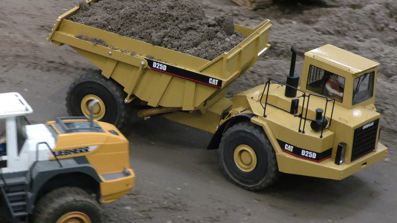 CAT D25D driving at the construction site - YouTube