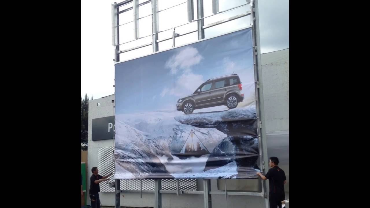 Wall mounted advertising banner lift system 1 - YouTube