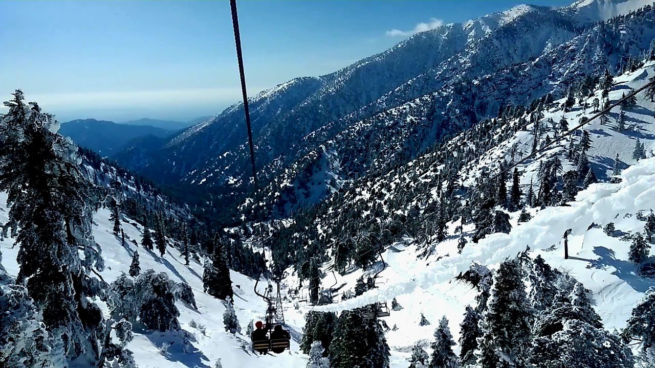 Very scenic chair lift ride winter wonderland at snow covered Mt Baldy ...
