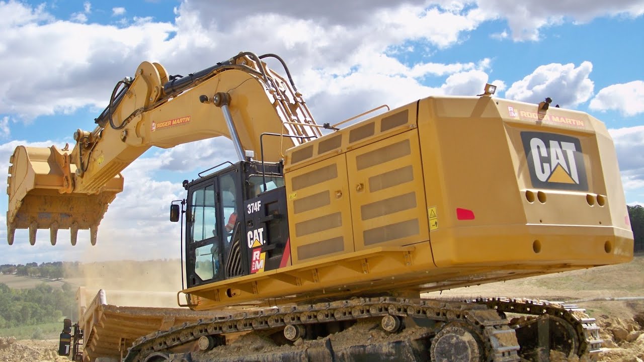 Caterpillar 374F Loading 769C - YouTube