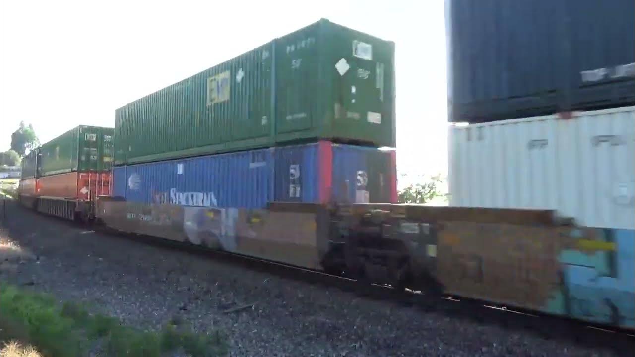 (Northbound) UP Intermodal Train passes through the Sunnyside Beach Pedestrian Railroad Crossing ...