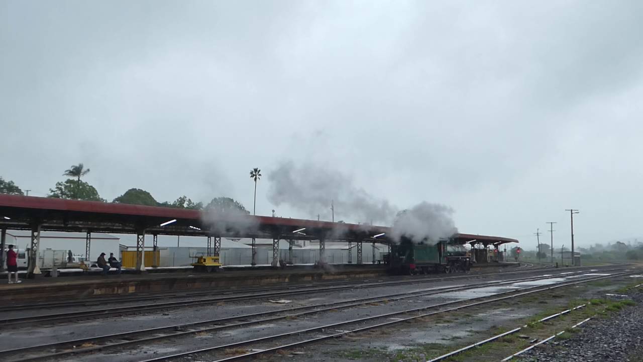 Steam locomotive QR 1089 running light engine along the platform at ...