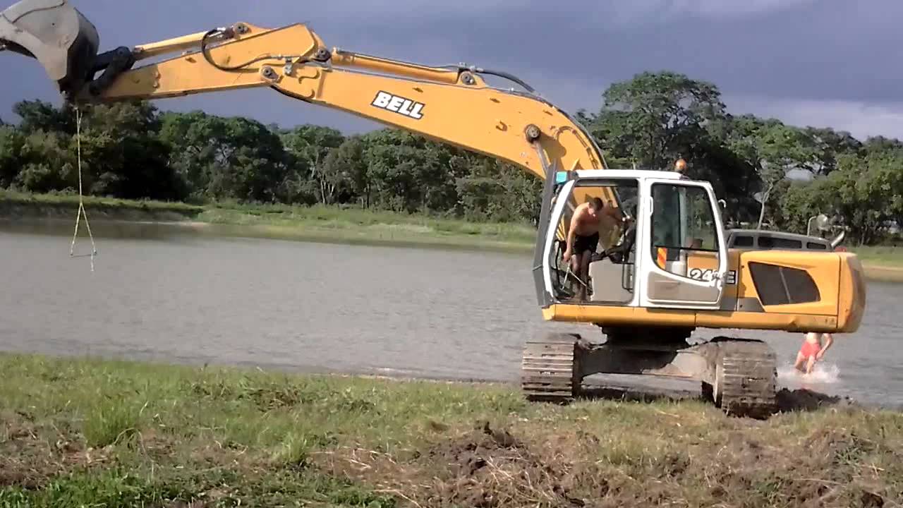 Excavator sling shot fun - YouTube