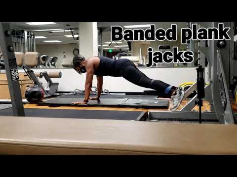 Banded plank jacks - YouTube