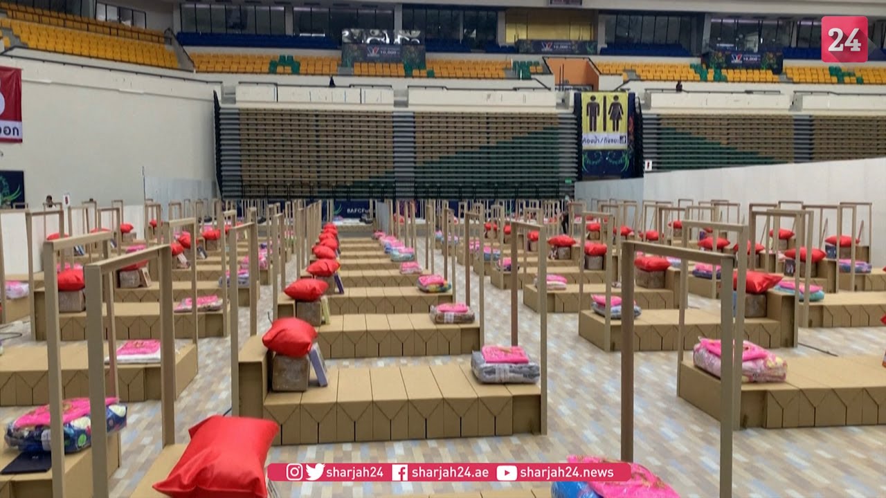Bangkok Arena made into field hospital with cardboard beds - YouTube