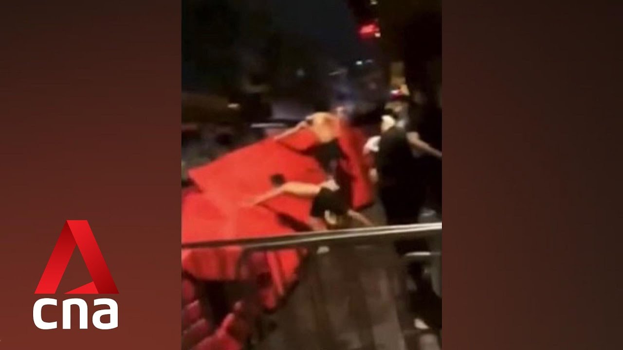 Crowds in Guangzhou crash through barricades and march down streets to ...
