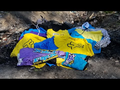 Burning pile of Old Fox Racing / Volcom Clothes.