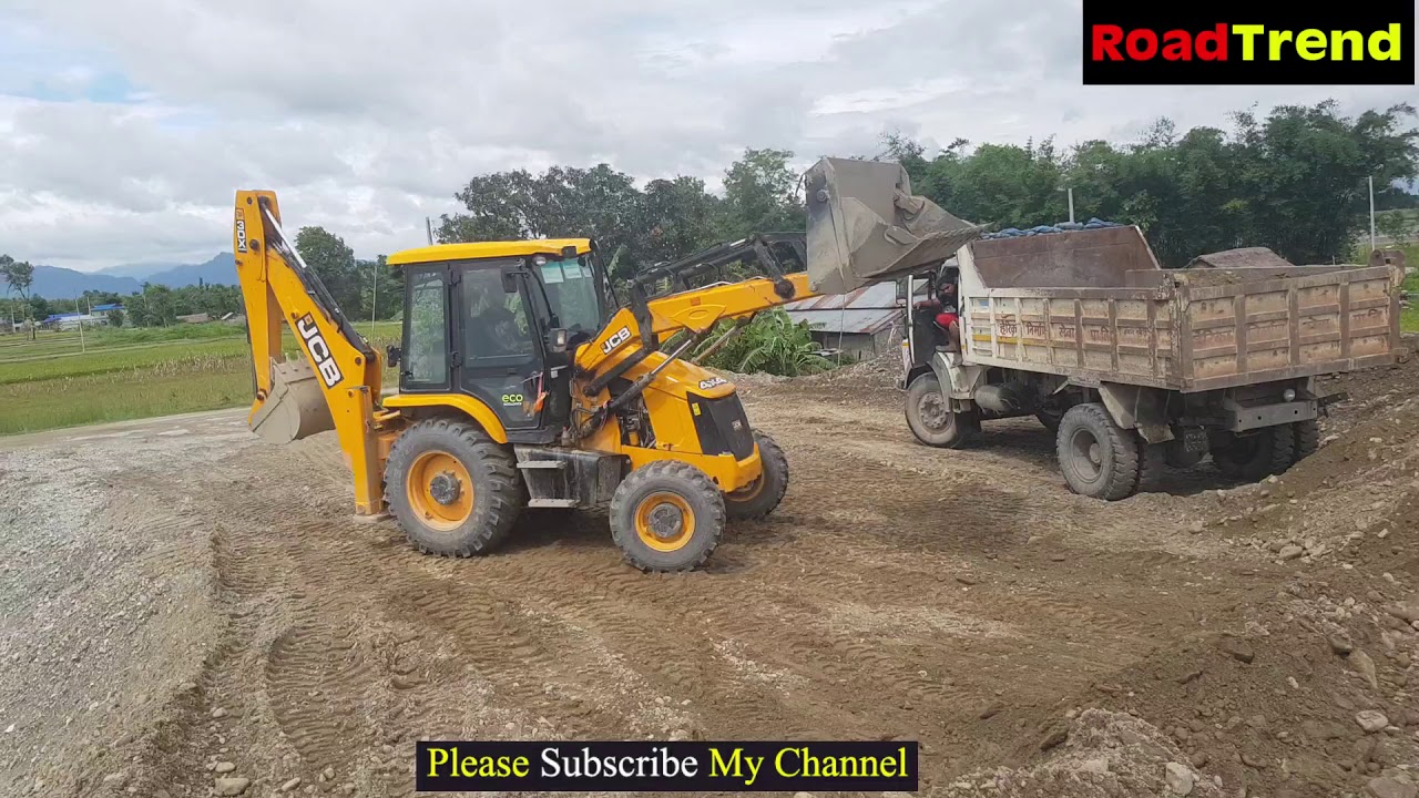JCB Backhoe loading gravel in tipper. - YouTube