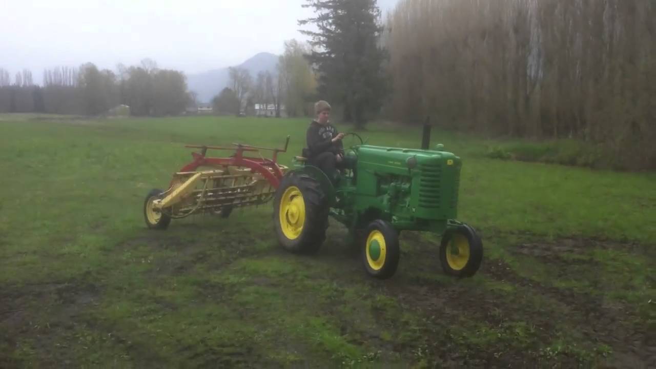 John Deere M running a rake - YouTube