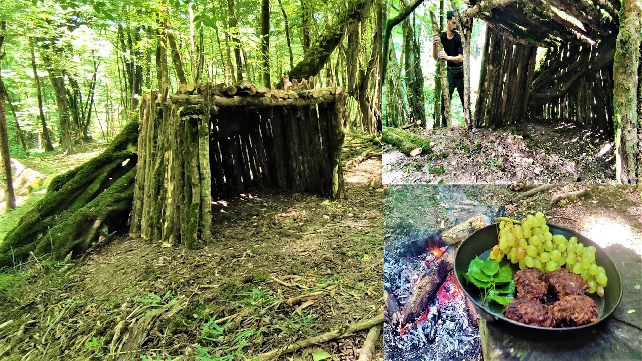 Bushcraft shelter in forest. Building wooden structures in the forest ...