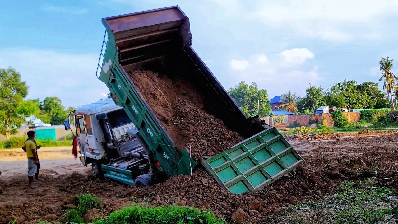 Dump Truck Stuck in Deep Mud | Hyundai Dump Truck Unloading Soil ...