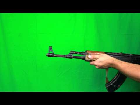 man turns around and shoots with ak-47 - HD green screen footage