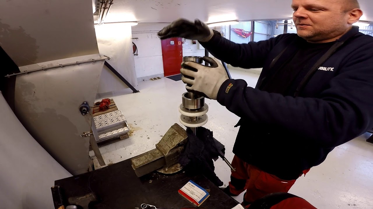 Replacing bearing on scraper idle shaft on the MudCube - YouTube