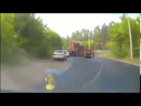 Shocking moment asphalt steamroller runs over a man - YouTube