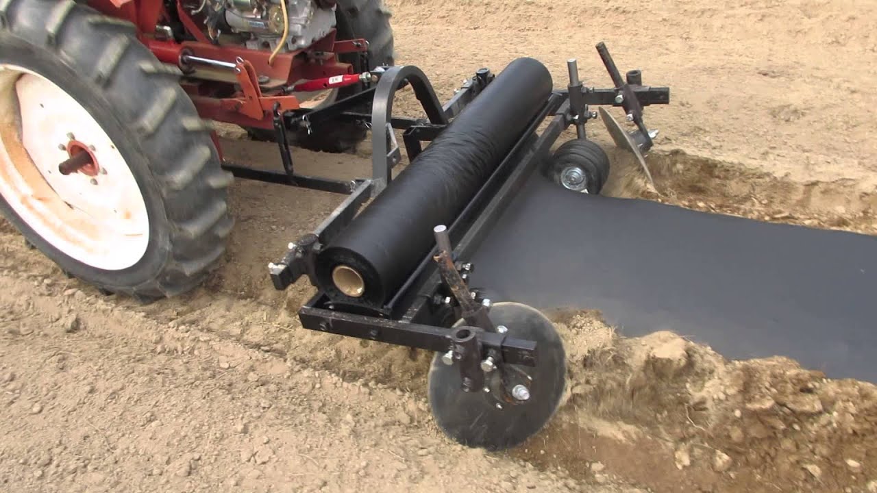 A Tuff bilt Tractor using our new Mulch Applicator - YouTube