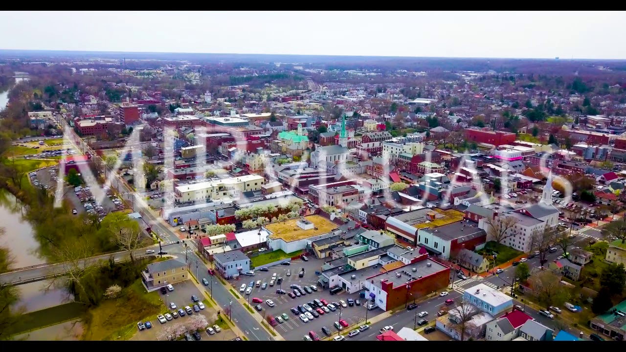Stock footage of a drone flying over small town 4K_MjrVisuals Stock ...