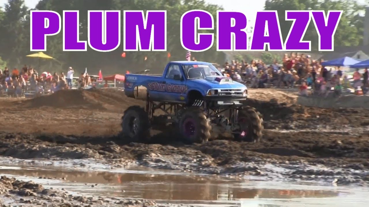 PLUM CRAZY MEGA TRUCK MUDDING FROM MID MICHIGAN MUDFEST - YouTube
