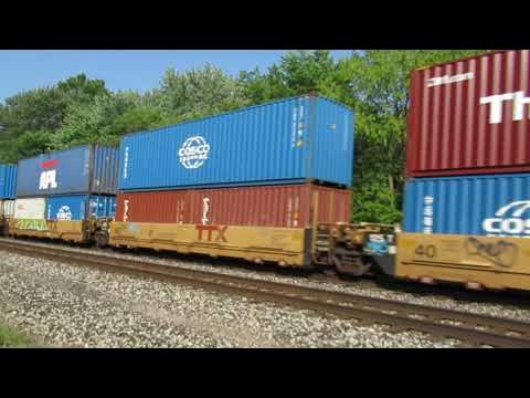 CN 2247, NS 8079, CN 5346 moving an Eastbound intermodal container, SP auto carrier freight ...