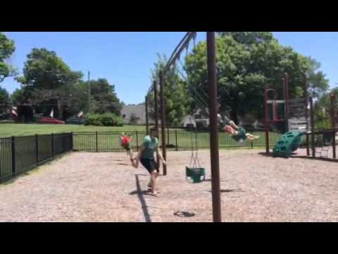 Pushing kids on swing - YouTube