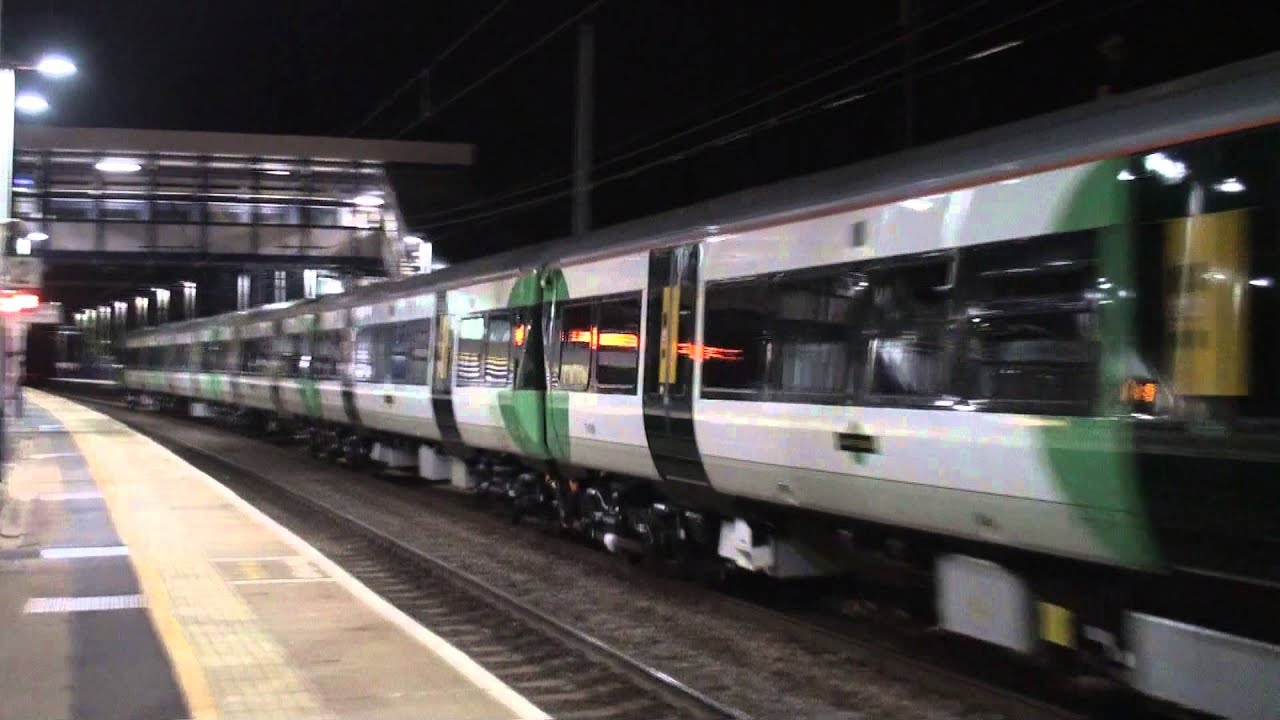 Network Rail 57310 drags ex-works Southern 377606 through Harpenden ...