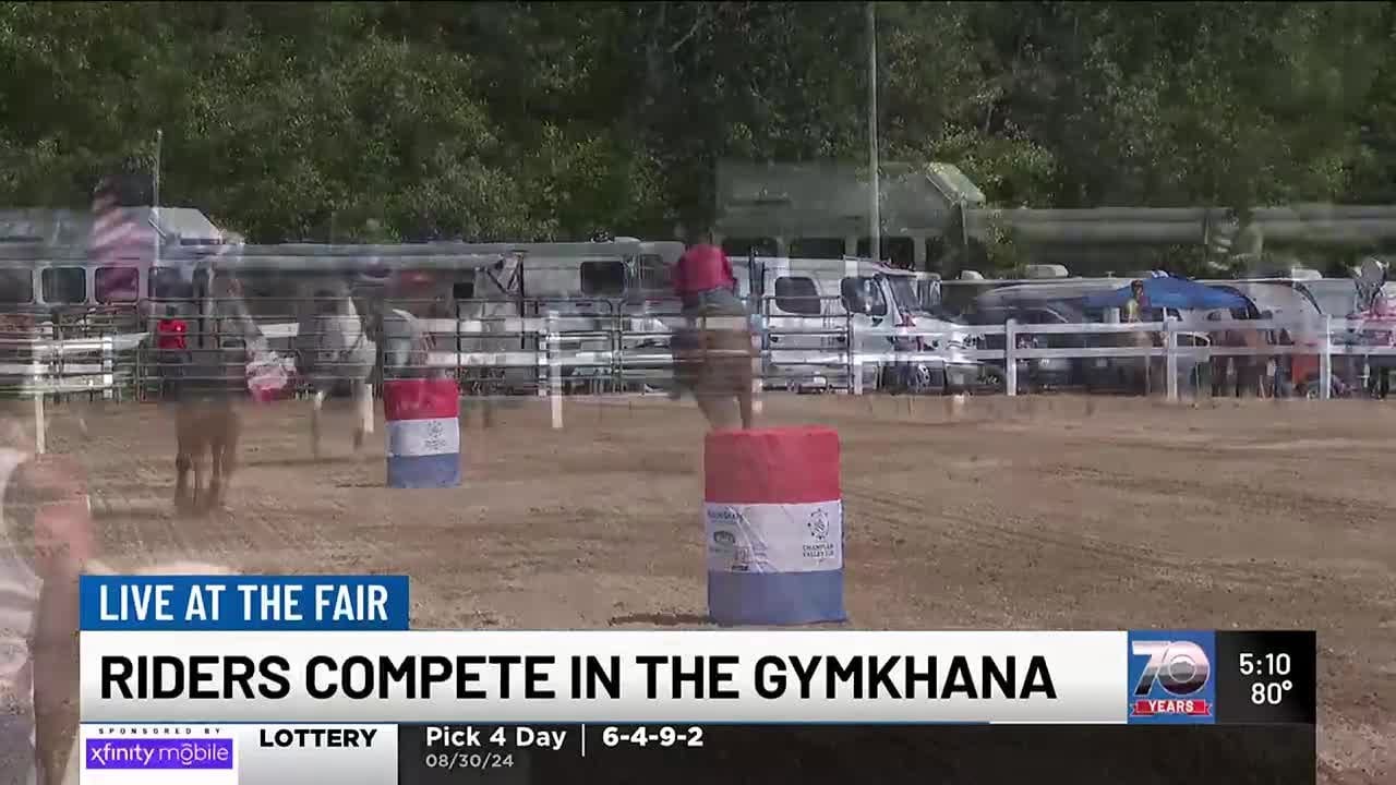 Equestrians take part in fair gymkhana event - YouTube