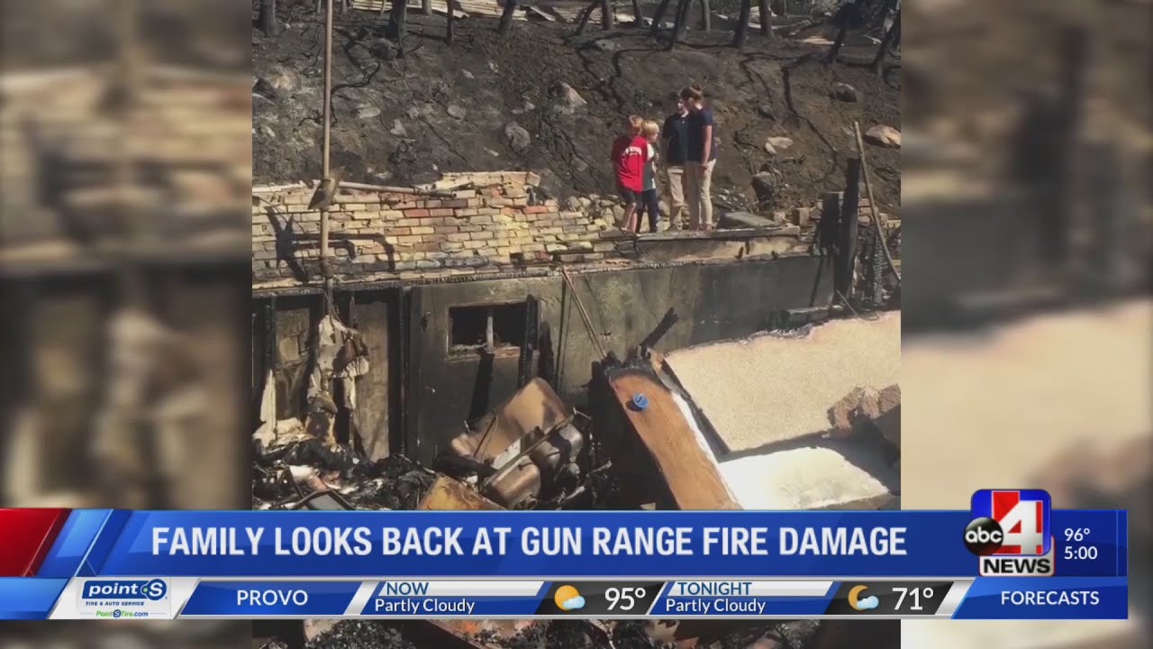Family walks through burnt rubble after Gun Range Fire destroys home (5 ...
