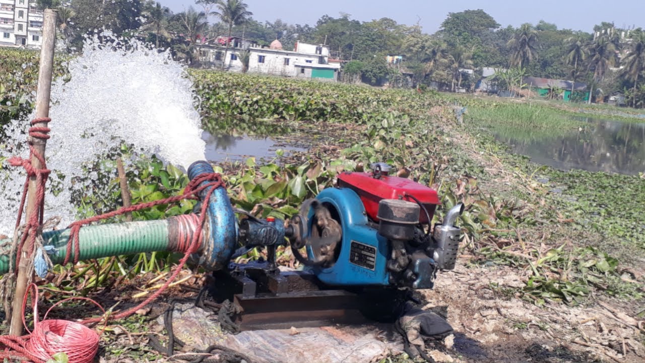 New water irrigation machine and traditional maximum people uses pond ...