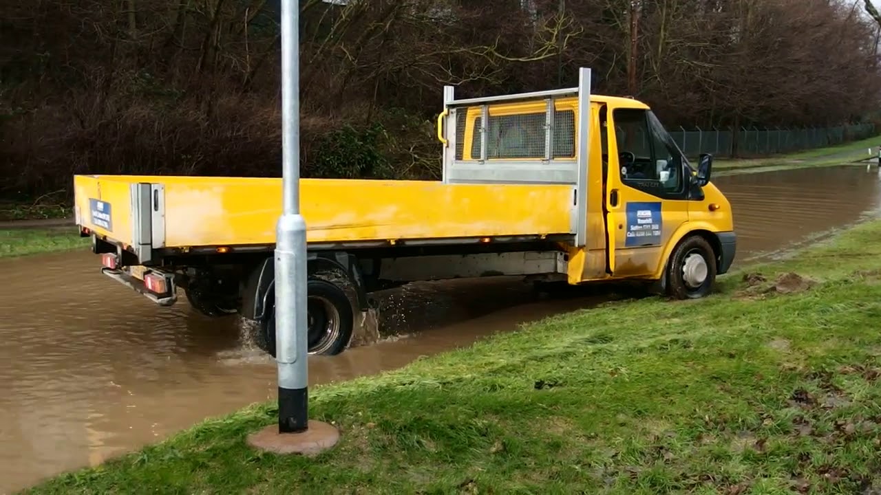 Flatbed Van Stuck in Mud - YouTube