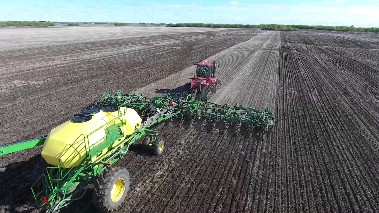 Seeding some canola on flax straw - YouTube