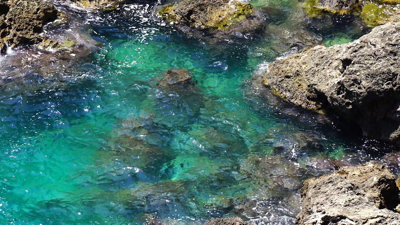 Turquoise sea and cliffs - YouTube