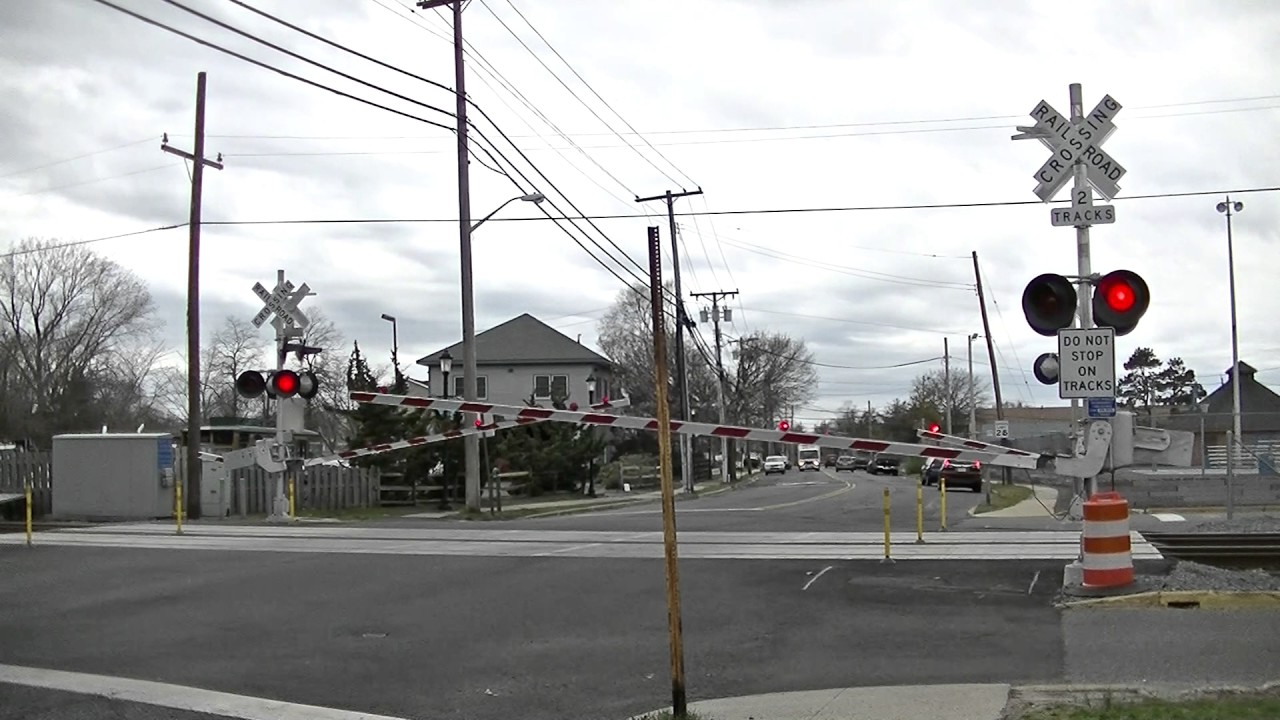 NJ Transit train sails through newly upgraded Belmar Crossing - YouTube