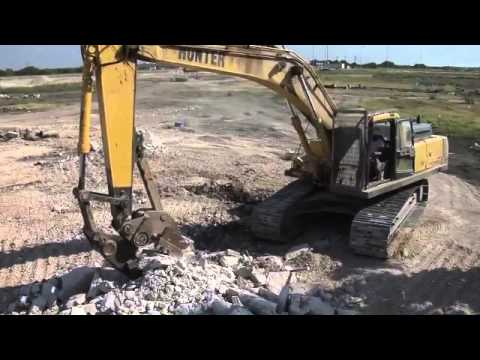 Genesis Mechanical Pulverizer Crushes Concrete Wall - YouTube