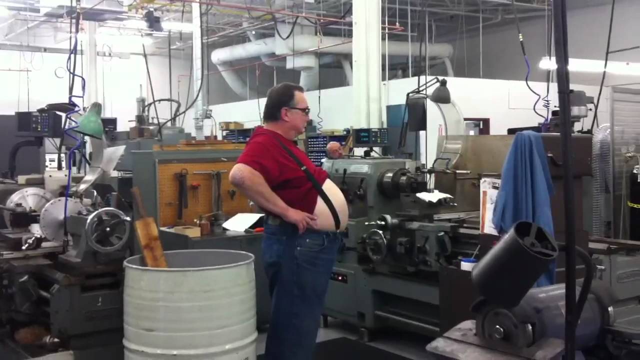 Fat man in machine shop - YouTube