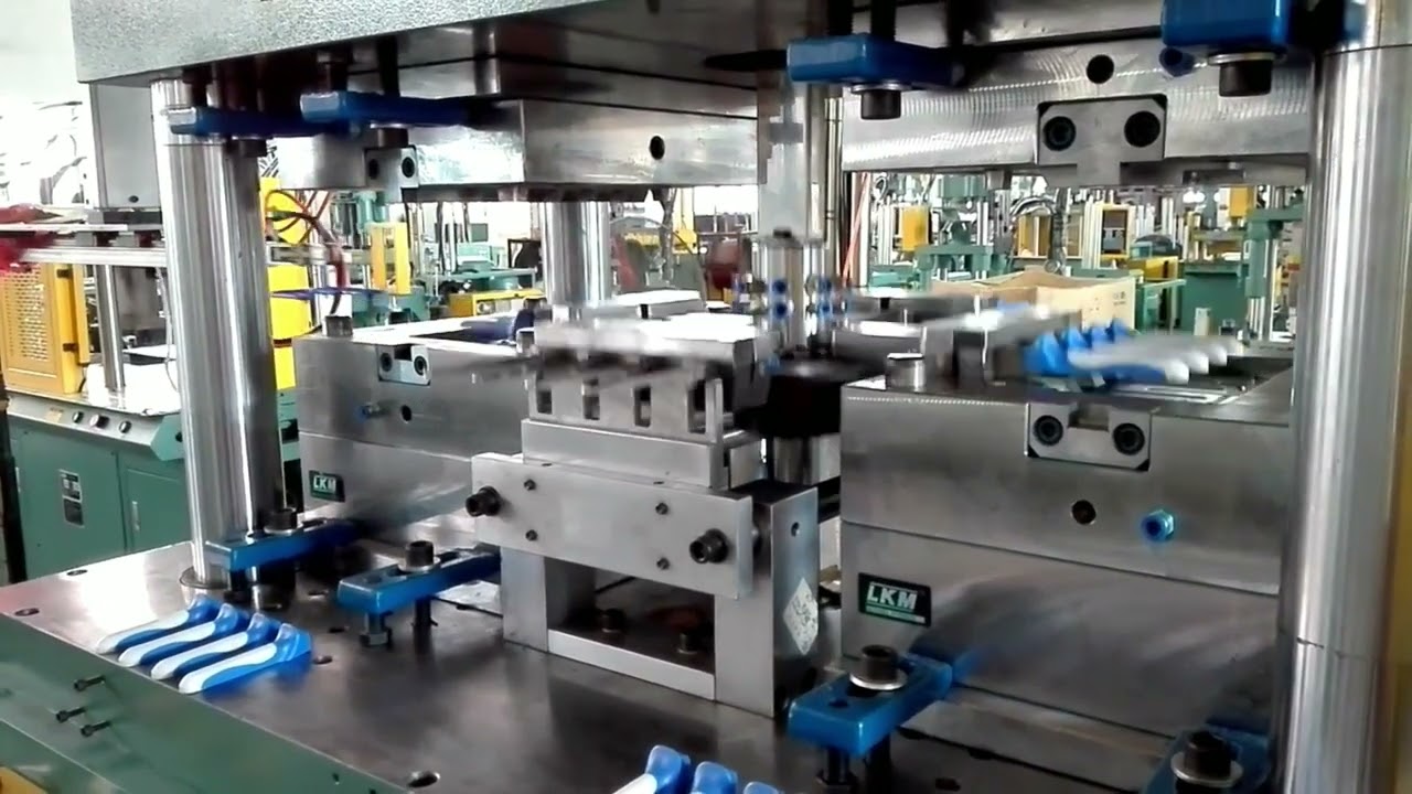 The new guy coming into two-color handle production line. - YouTube
