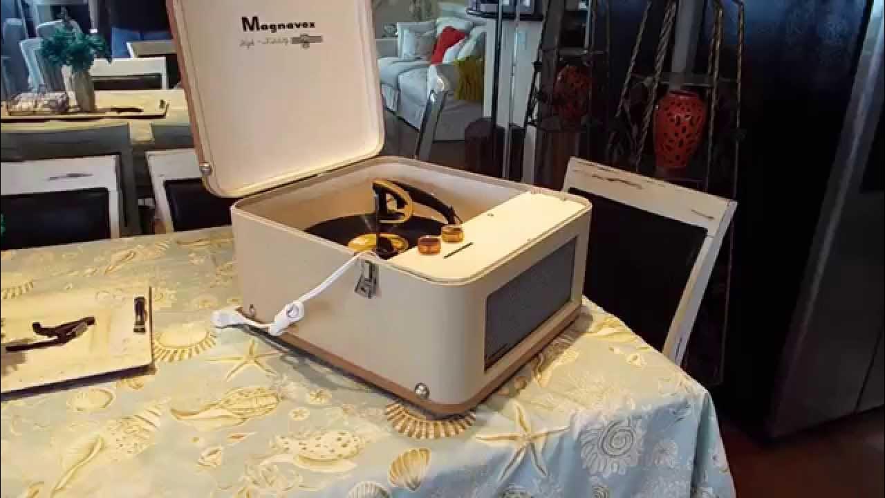 Magnavox Automatic record player playing a stack of LP 33.3 RPM records ...