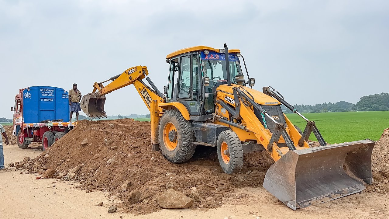 JCB 3DX Helps set Slope to Komatsu GD405A Grader Loading in Truck | jcb ...