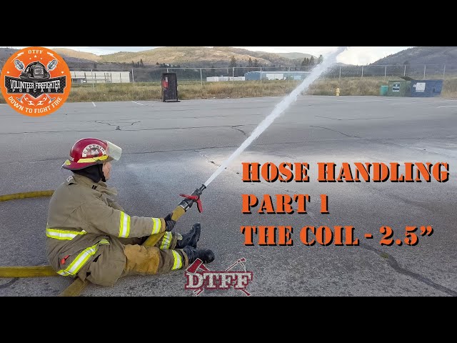 Firefighter Fighting Fire With Hose