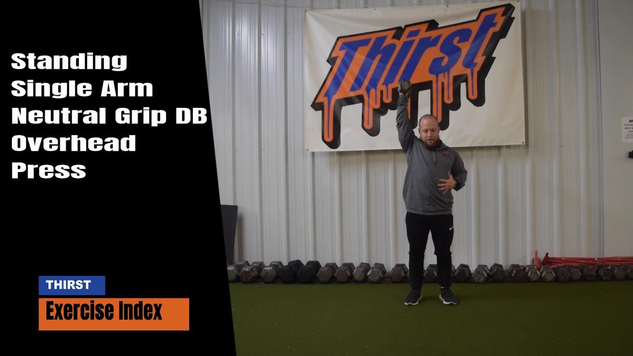 Standing Single Arm Neutral Grip DB Overhead Press - THIRSTgym.com ...