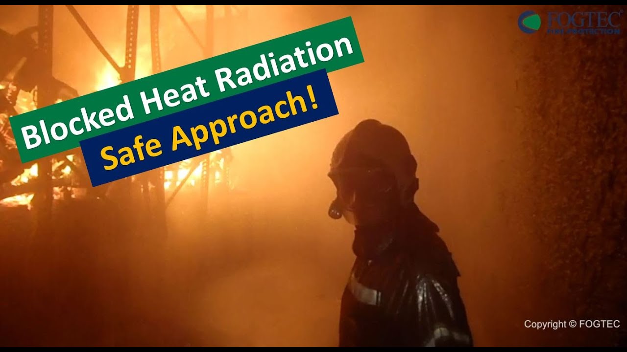 FOGTEC - Fire Fighter right next to full scale fire scenario with ...