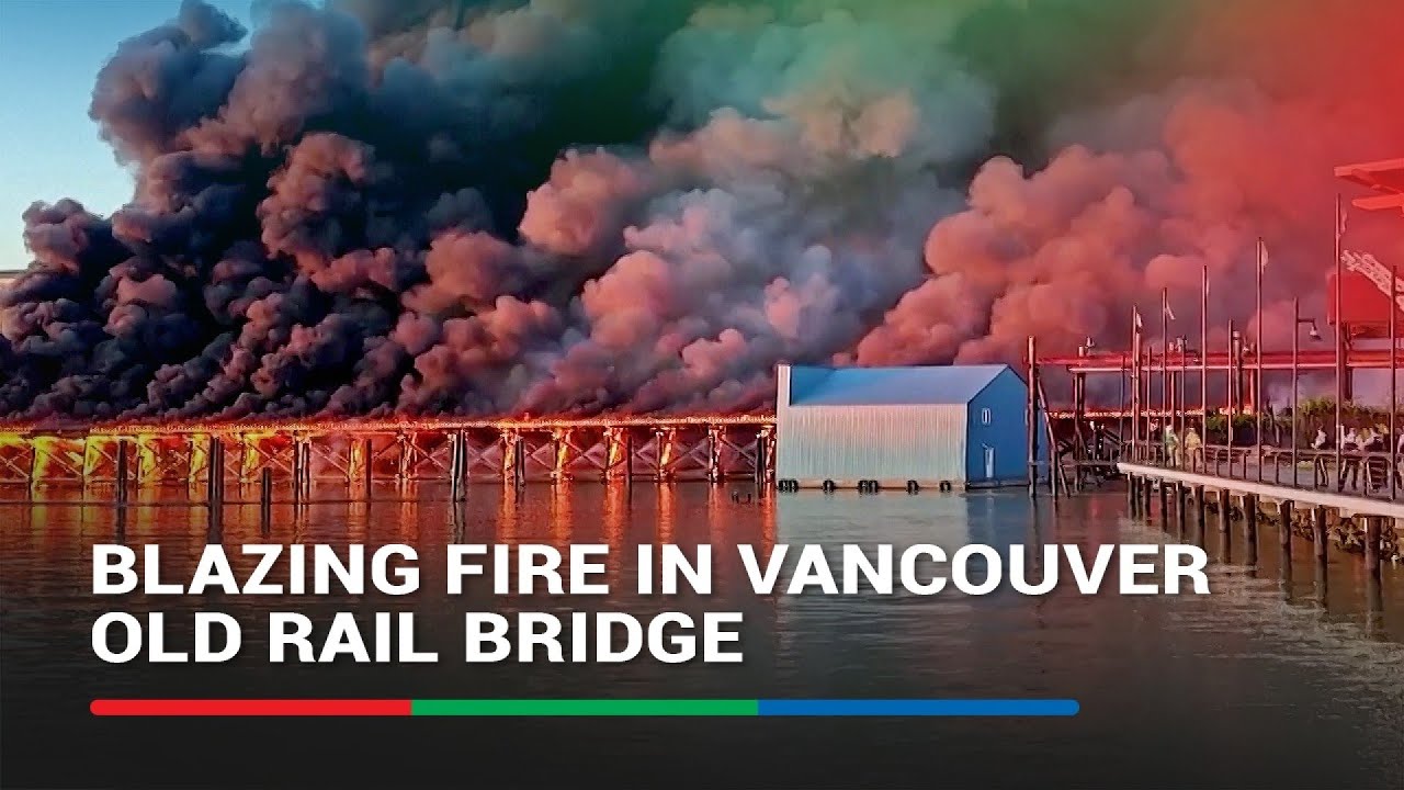 Firefighters battle blazing fire that engulfed old rail bridge in ...